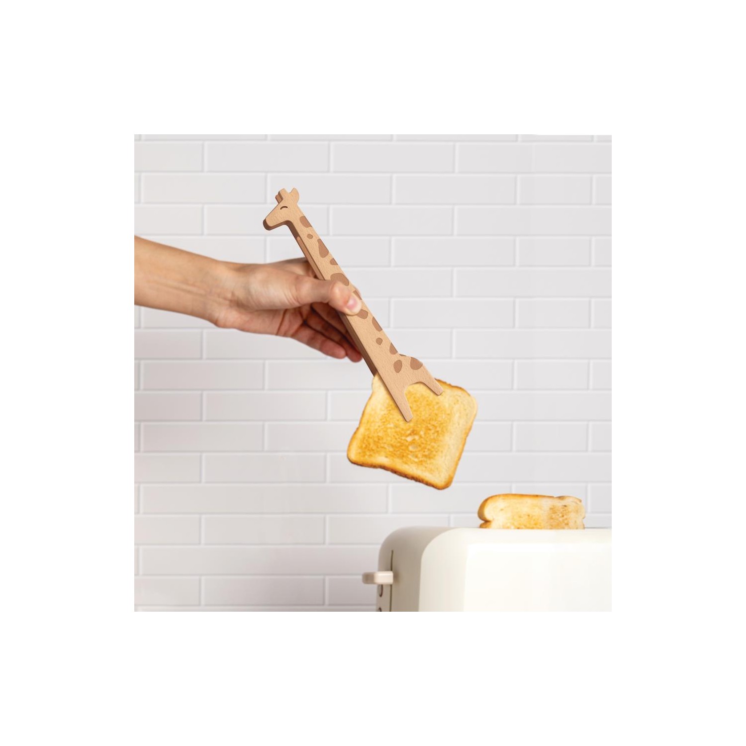 Meet Jerry, the giraffe-shaped wooden tongs that reaches into toasters!